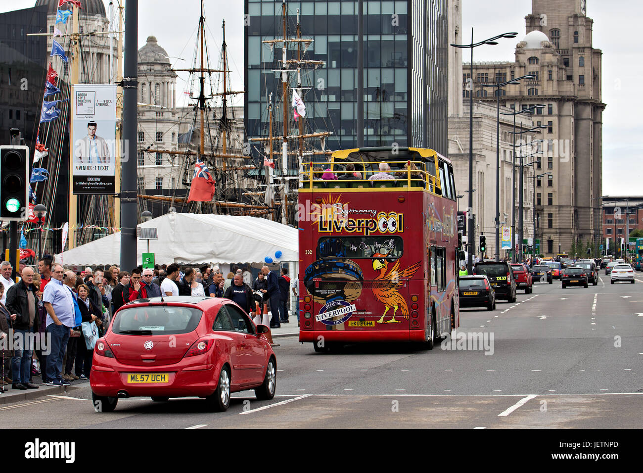 Liverpool open top sightseeing bus traveling along the Strand in ...