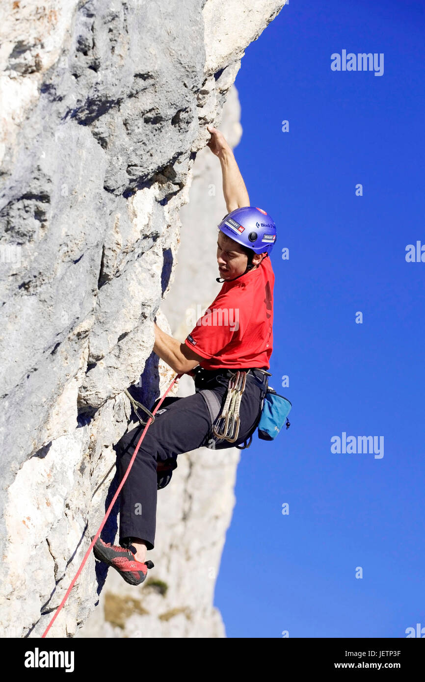 Man climbs in the mountain, Mann klettert am Berg Stock Photo - Alamy