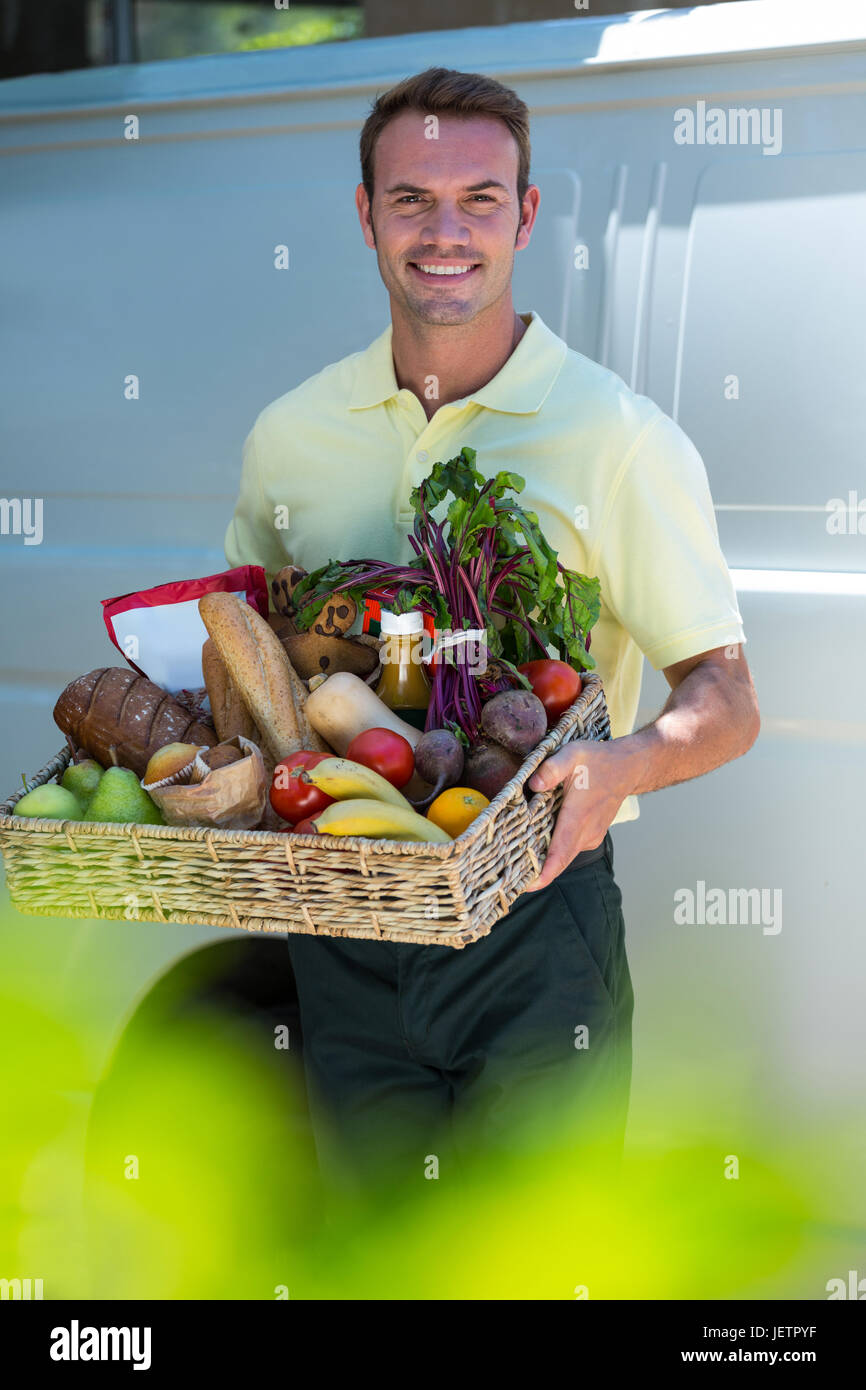 Happy man delivering groceries Stock Photo - Alamy