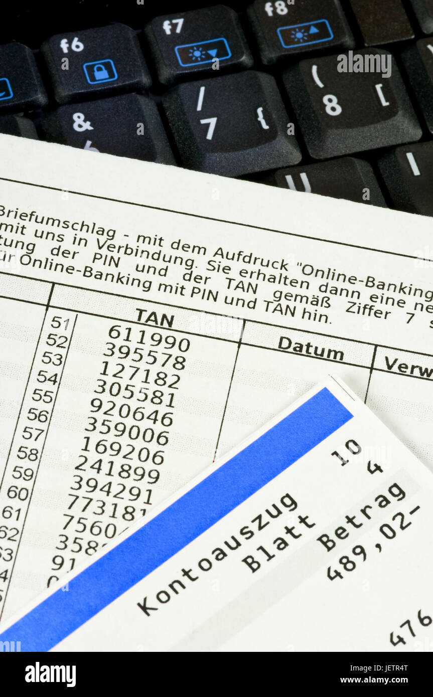 TAN list and bank statement on a PC keyboard recumbent, TAN-Liste und ...