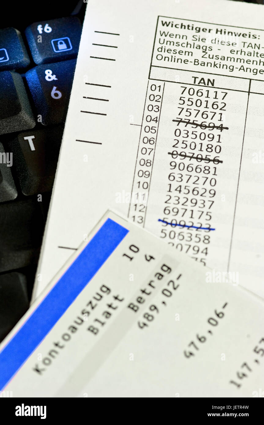 TAN list and bank statement on a PC keyboard recumbent, TAN-Liste und ...