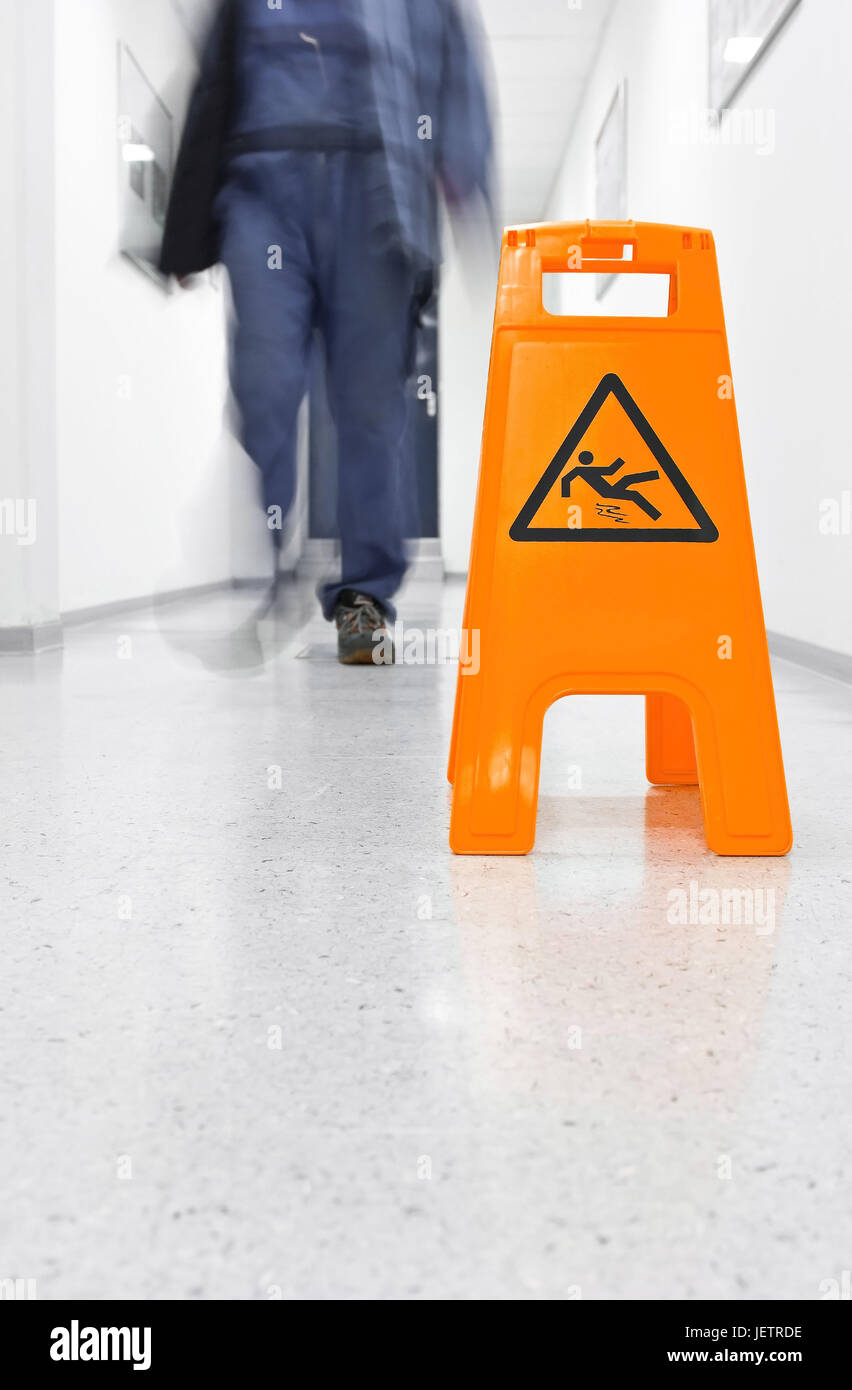 "Warning ""care of slide danger"" in a hall", "Warnschild ""Vorsicht ...