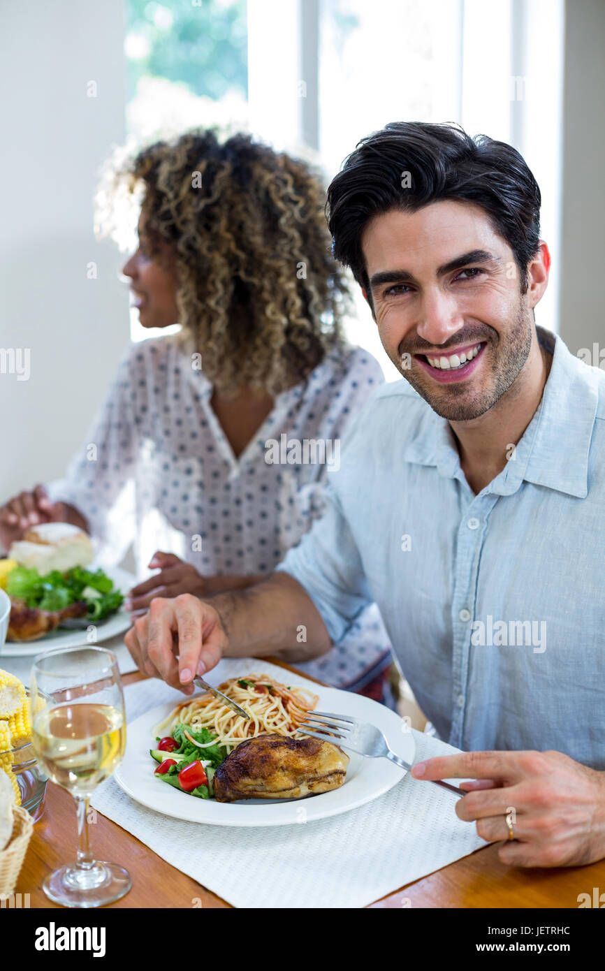 Portrait of happy man having meal Stock Photo - Alamy