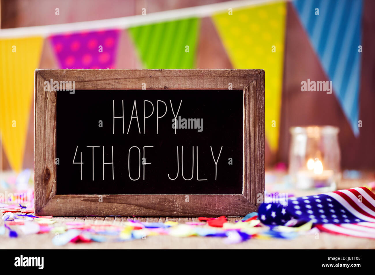 a wooden-framed chalkboard with the text happy 4th of july written in ...