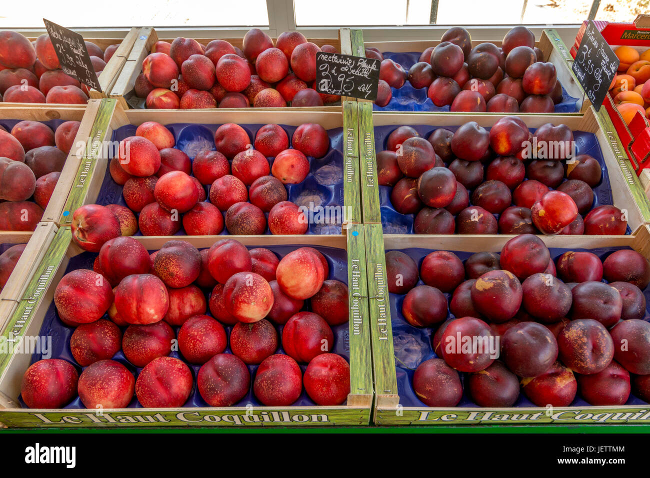 Nectarines displayed for sale on a market stall. Hérault. France Stock ...