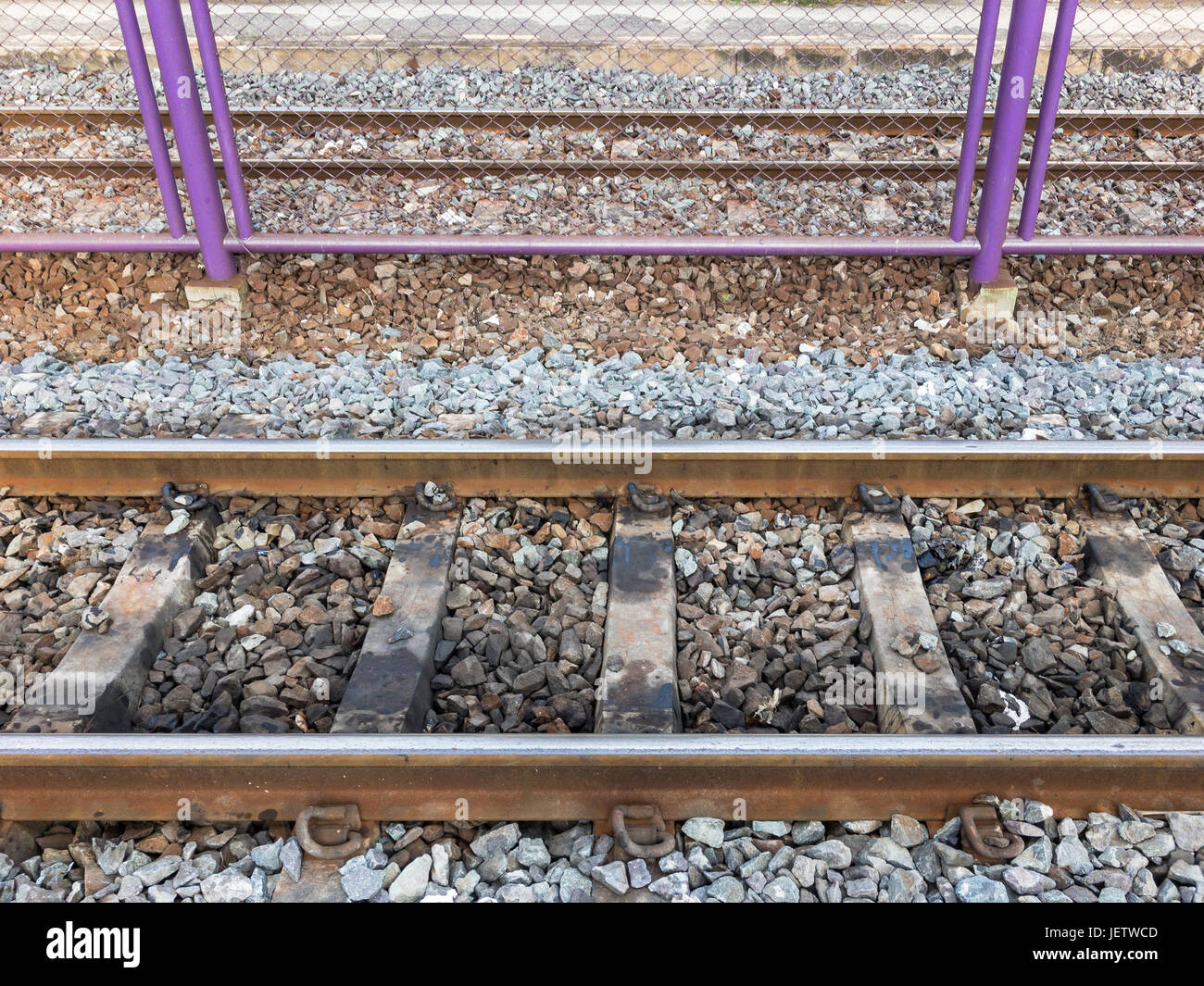 Metal fence for protection between the railway line in the train ...