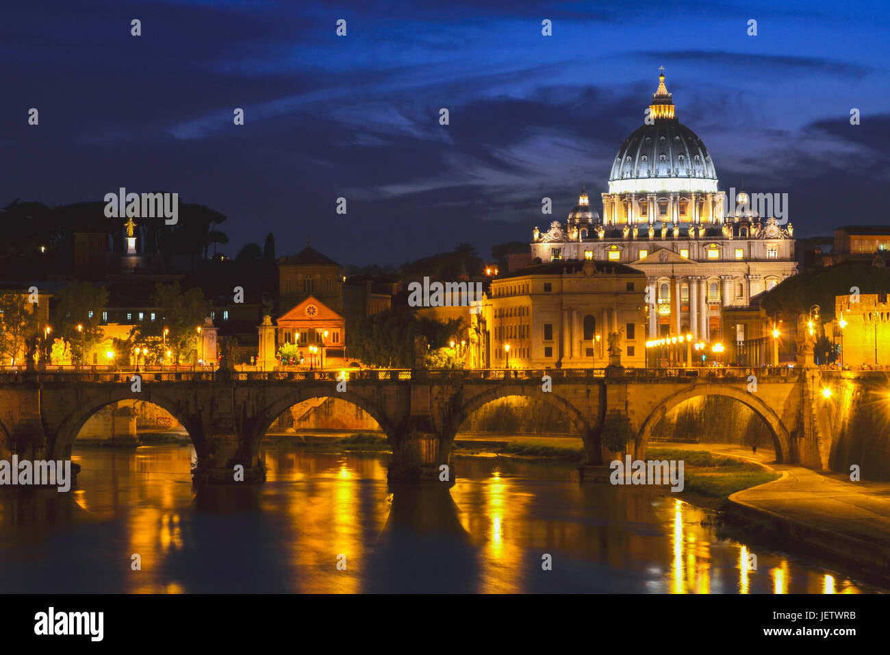 Monumental St. Peters Basilica over Tiber at twilight in Rome, Italy ...