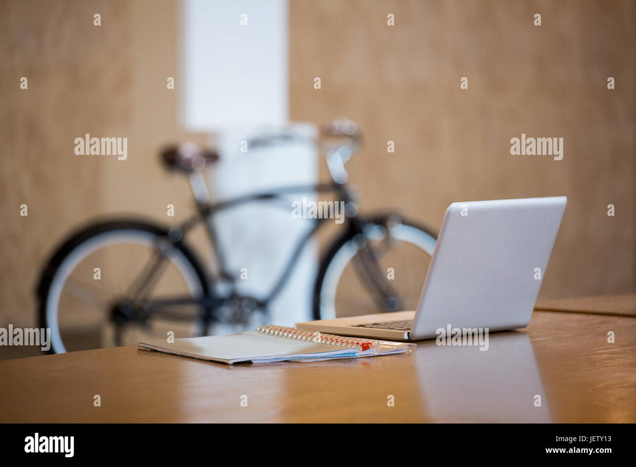 Laptop and file on desk Stock Photo - Alamy