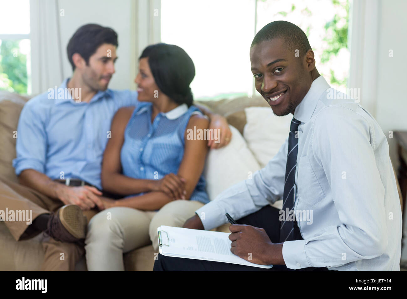 Portrait of a smiling real estate agent Stock Photo - Alamy
