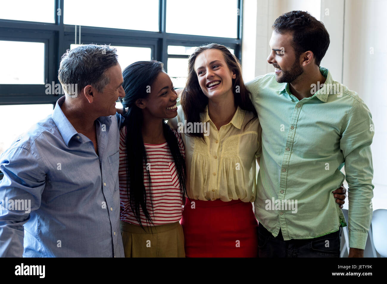 Team of colleagues posing together Stock Photo - Alamy