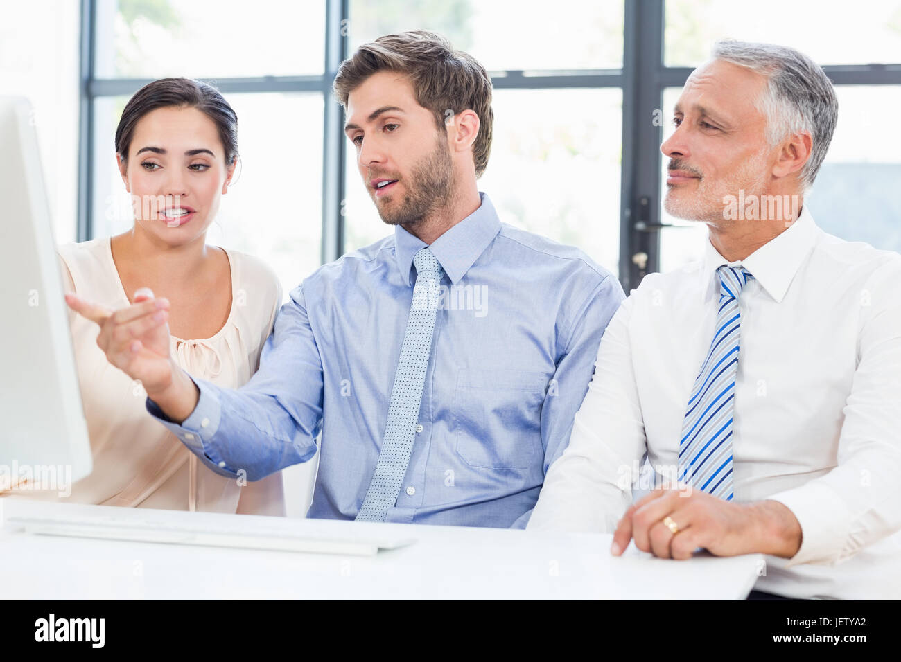 Business colleagues discussing during meeting Stock Photo - Alamy