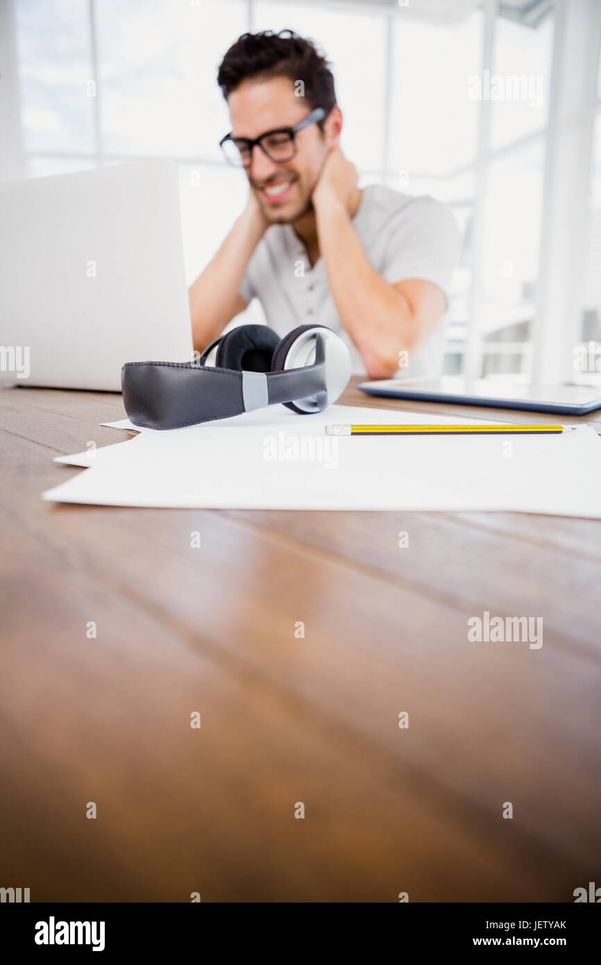Young man working at his desk Stock Photo - Alamy
