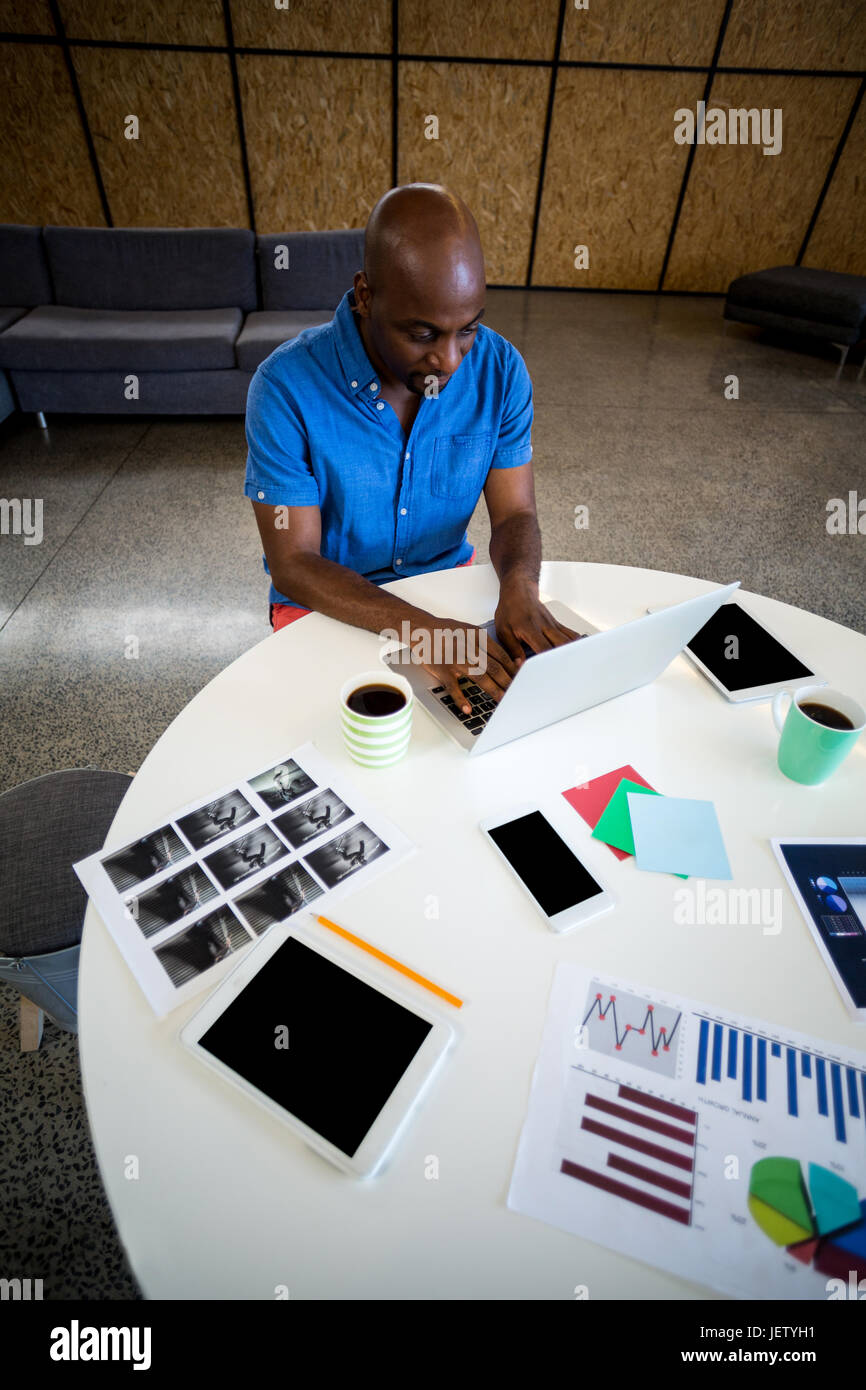 Man working at his desk Stock Photo - Alamy