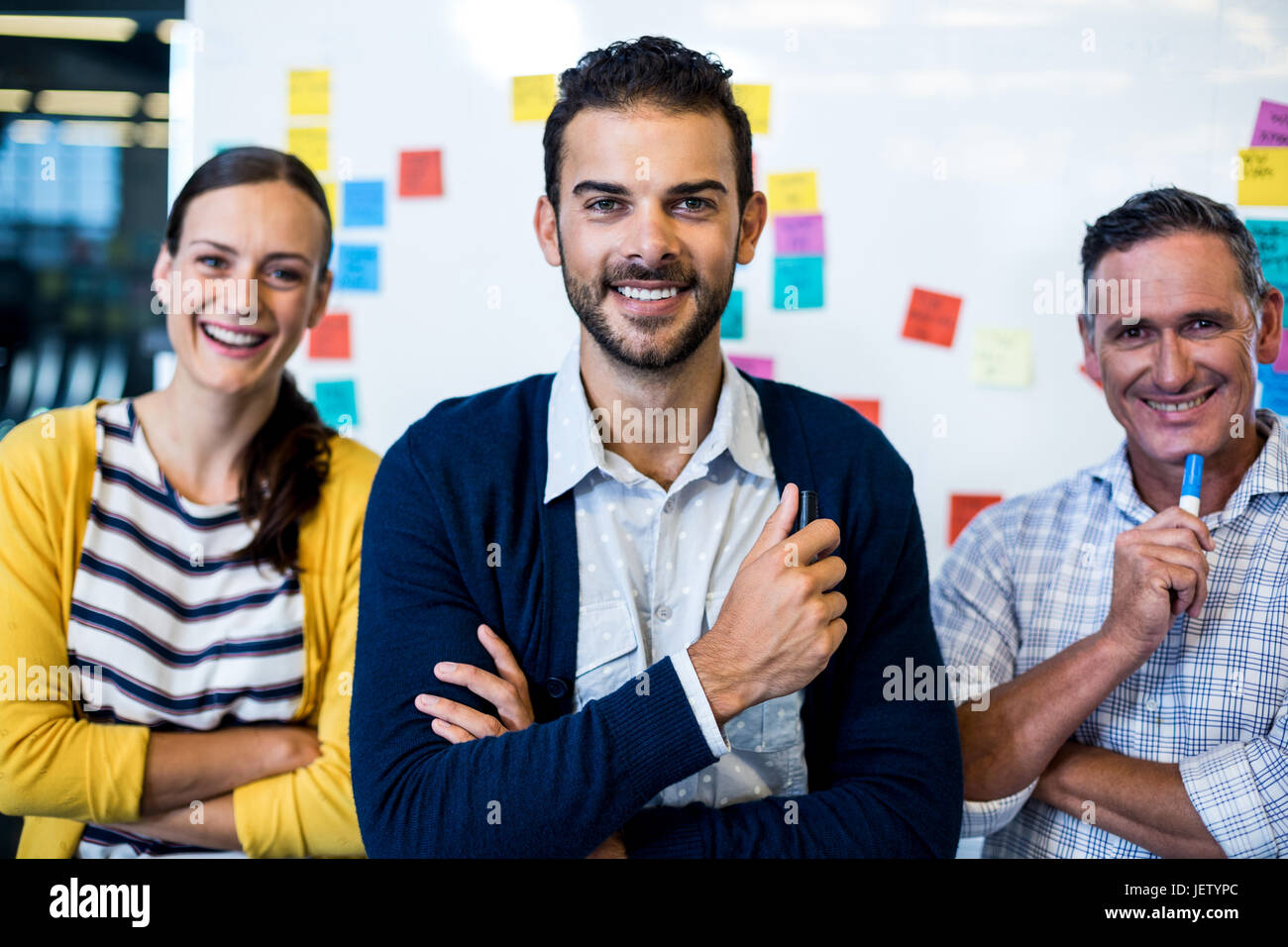 Colleagues smiling at camera Stock Photo - Alamy