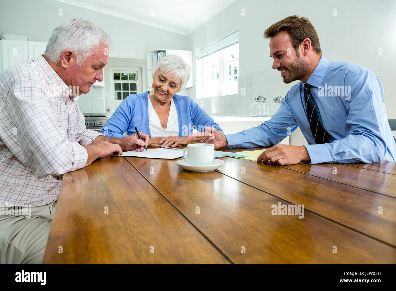 Senior couple discussing paperwork hi-res stock photography and images ...