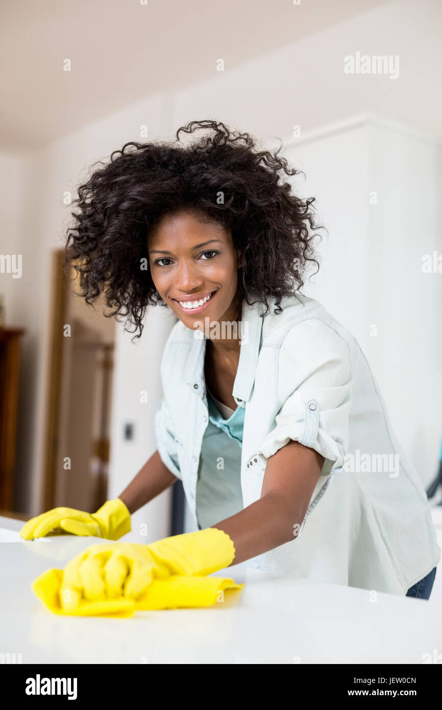 Woman cleaning kitchen counter Stock Photo - Alamy
