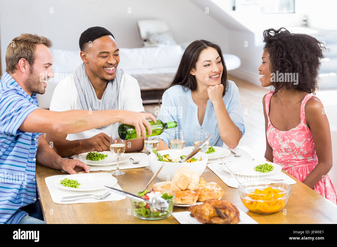 Man interacting female friend having hi-res stock photography and ...