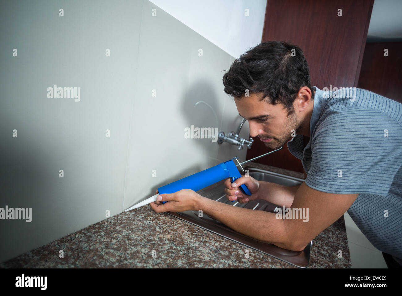Man using pest control injection Stock Photo - Alamy