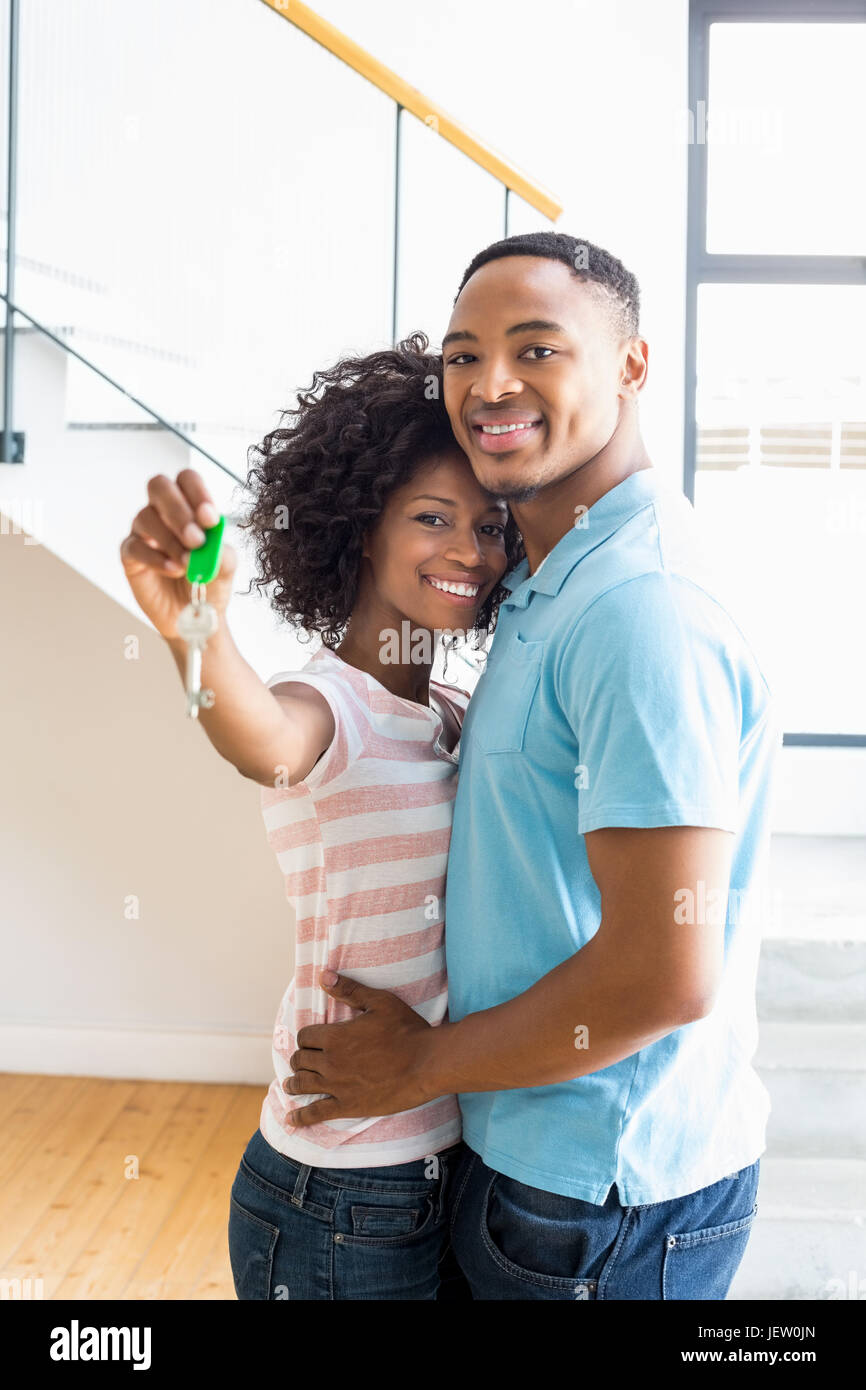 Happy couple embracing in their new home Stock Photo - Alamy