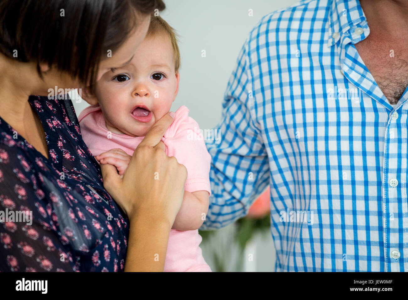 Parents are taking care of their baby Stock Photo - Alamy