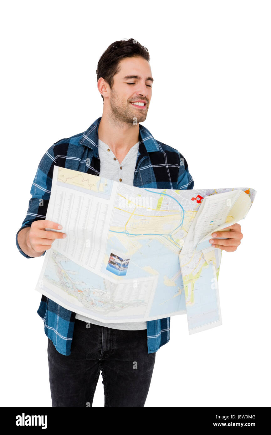 Young man looking at map Stock Photo - Alamy