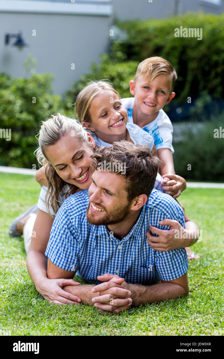 Happy family enjoying on grass in yard Stock Photo - Alamy Happy family enjoying on grass in yard Stock Photo - Alamy