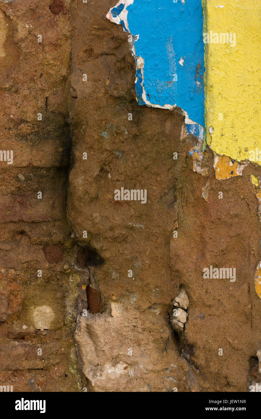 Detail of damaged facade wall with blue and yellow colours Stock Photo ...