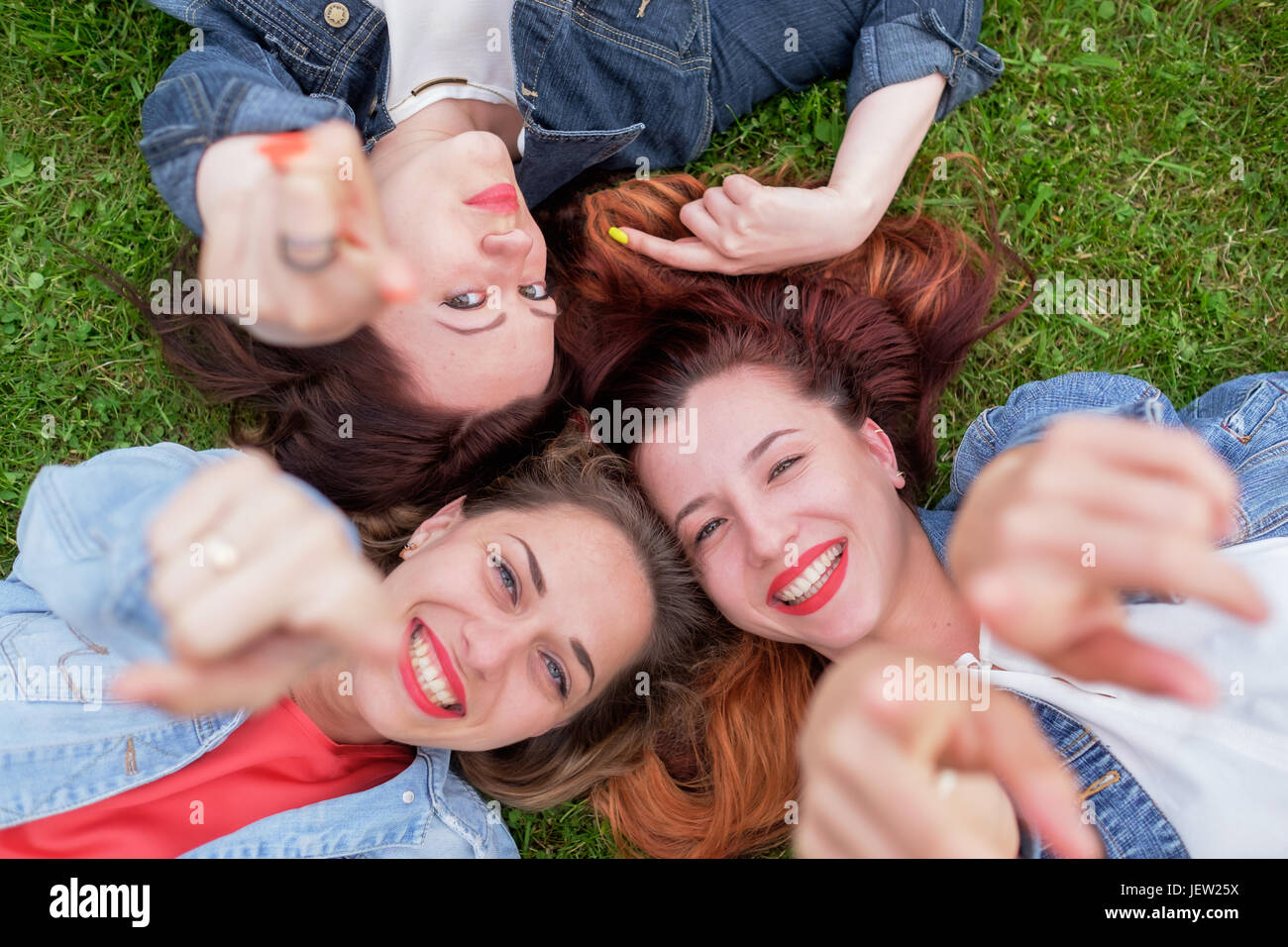 Happy friends in the park on a sunny day . Summer lifestyle portrait of ...