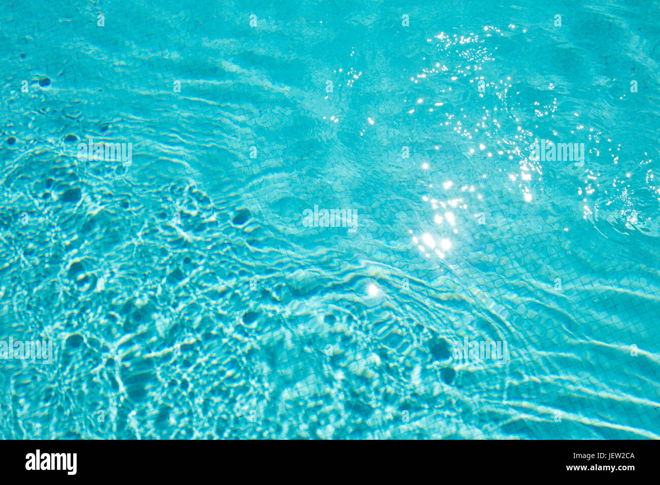 Detal of swimming pool water and sun reflecting on the surface Stock ...