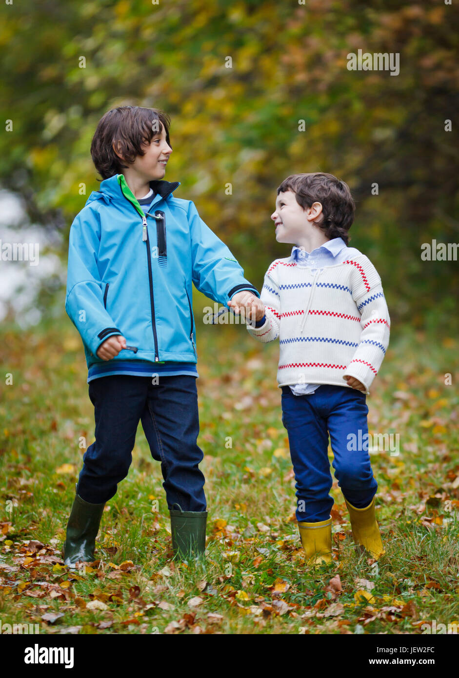 Boys walking together Stock Photo - Alamy