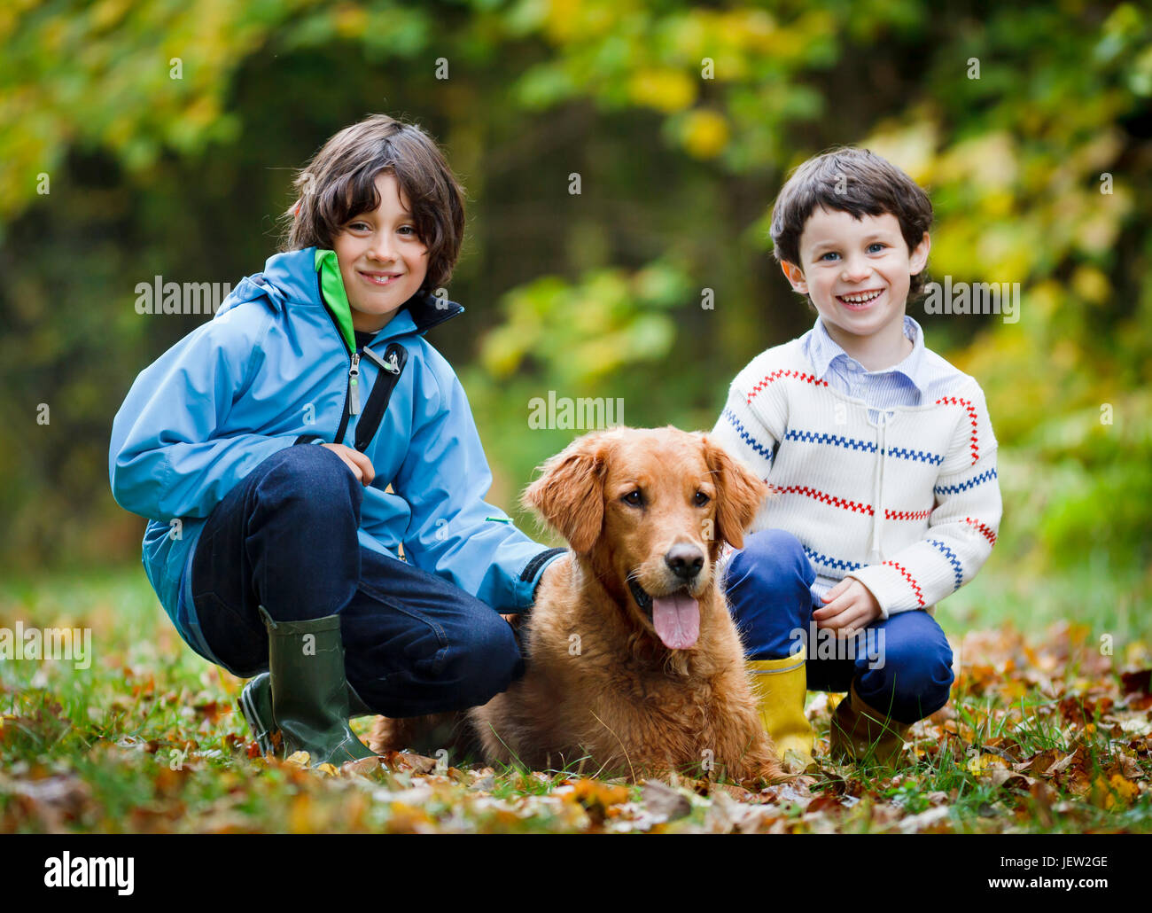 Two boys walk the dog hi-res stock photography and images - Alamy
