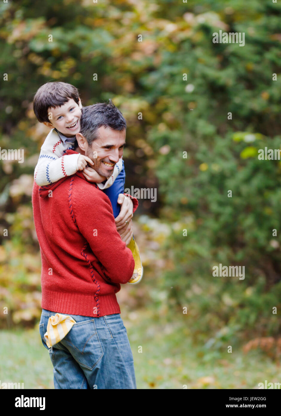 Father carrying son Stock Photo - Alamy