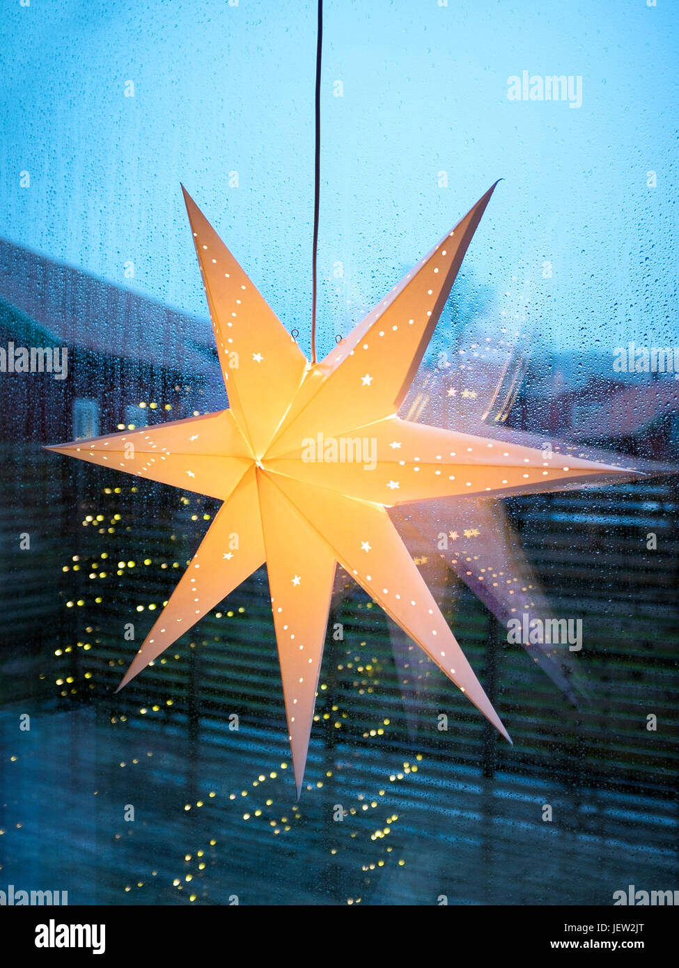 Illuminated star on window Stock Photo - Alamy