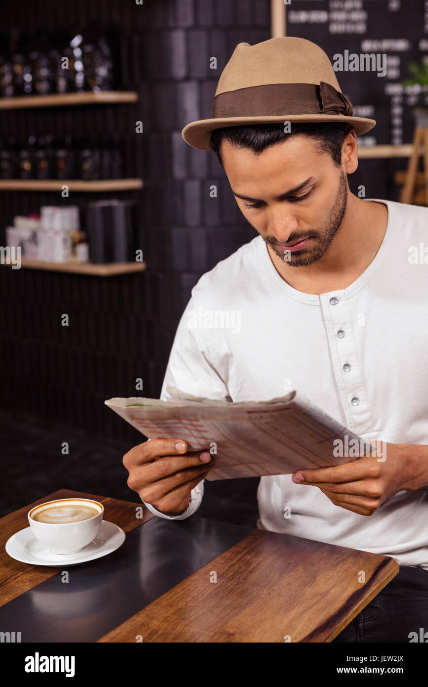 Concentrated man reading newspaper hi-res stock photography and images ...