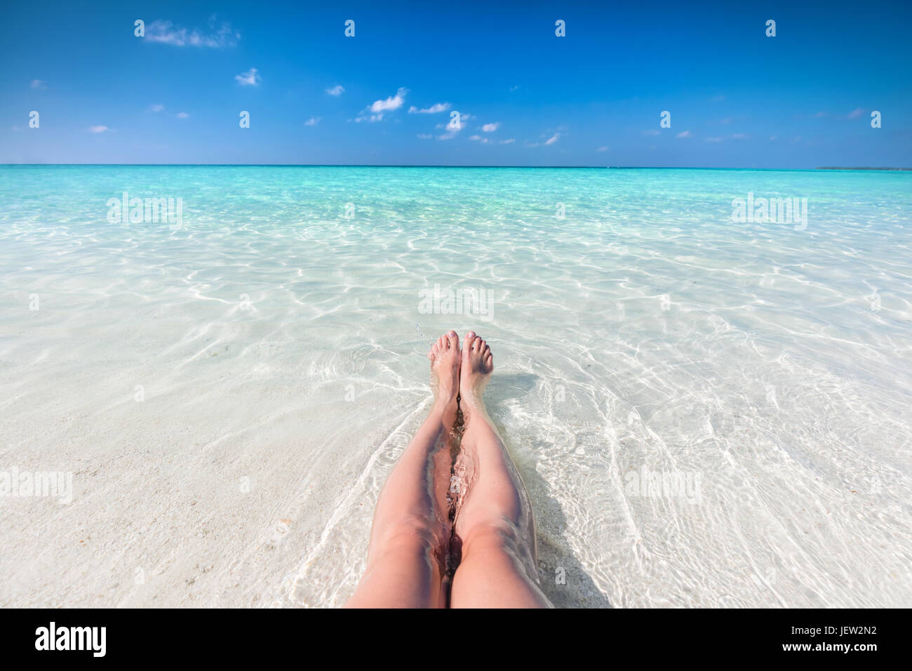 Woman's feet in sand hi-res stock photography and images - Alamy