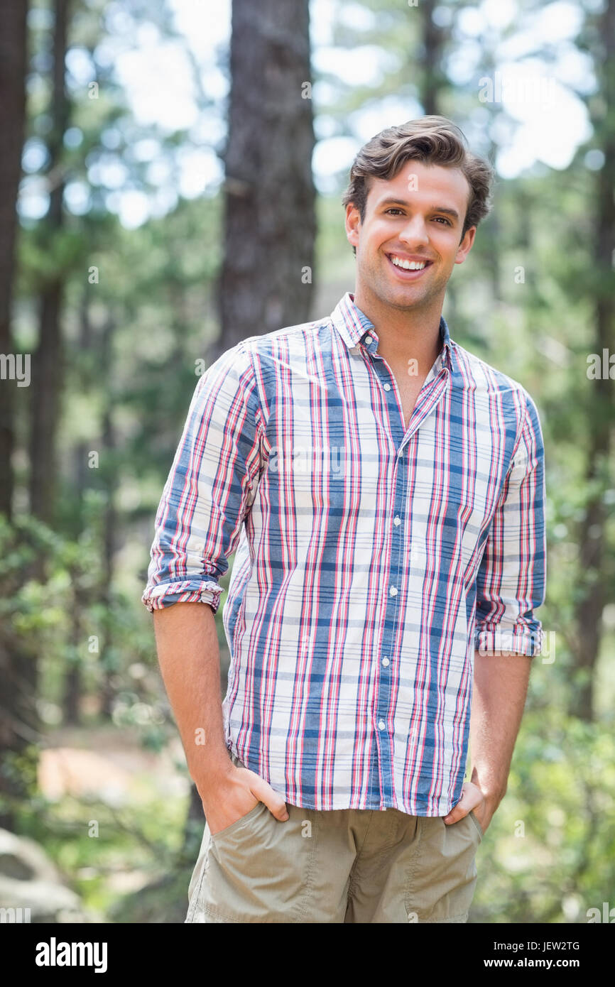 Handsome young man hiking in forest 20s adult hi-res stock photography ...