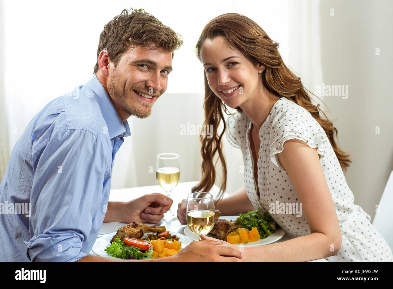 Romantic couple having lunch at home Stock Photo - Alamy