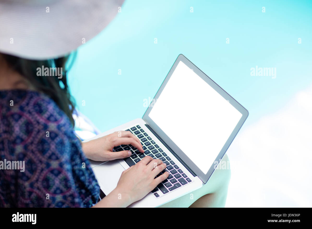 Woman using her laptop Stock Photo - Alamy