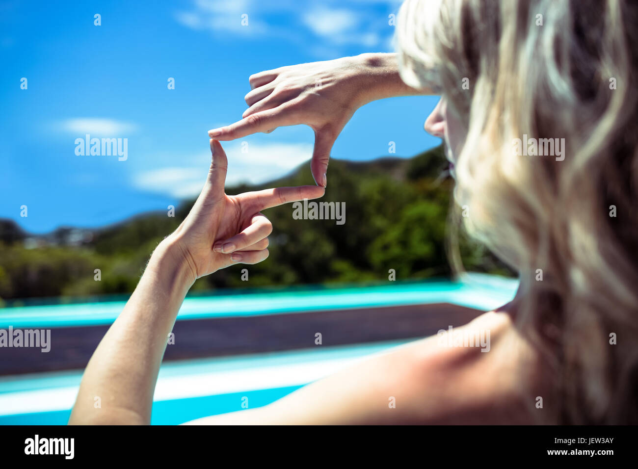 Woman making square with hands Stock Photo - Alamy