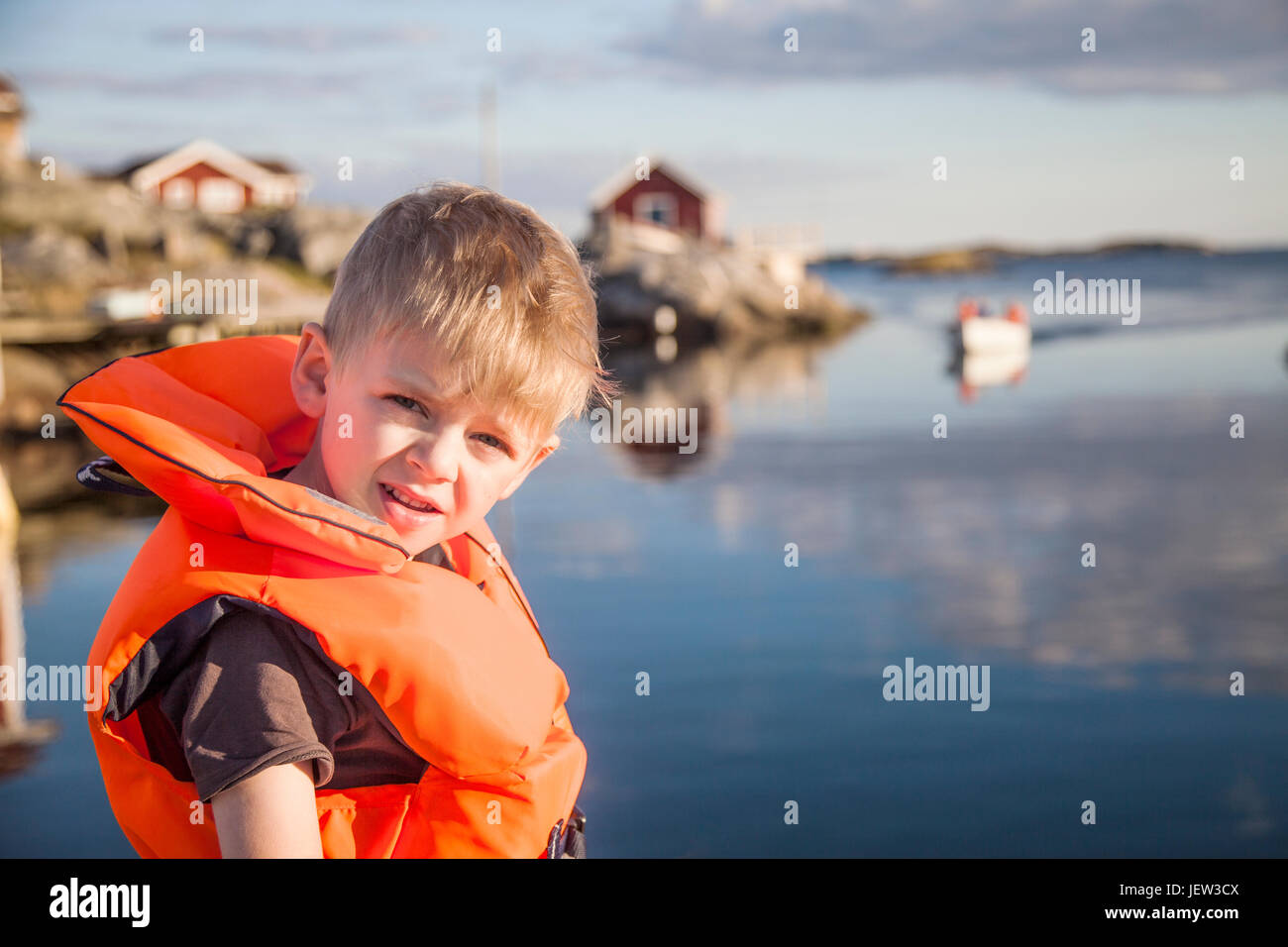 Wearing an orange life vest hi-res stock photography and images - Alamy