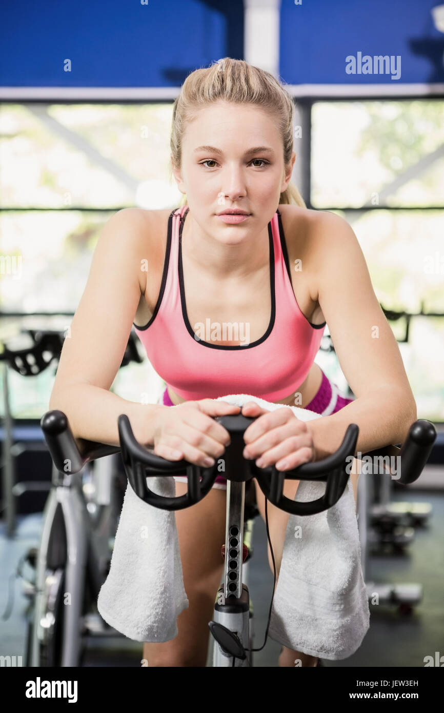 Woman sitting on exercise bike Stock Photo - Alamy