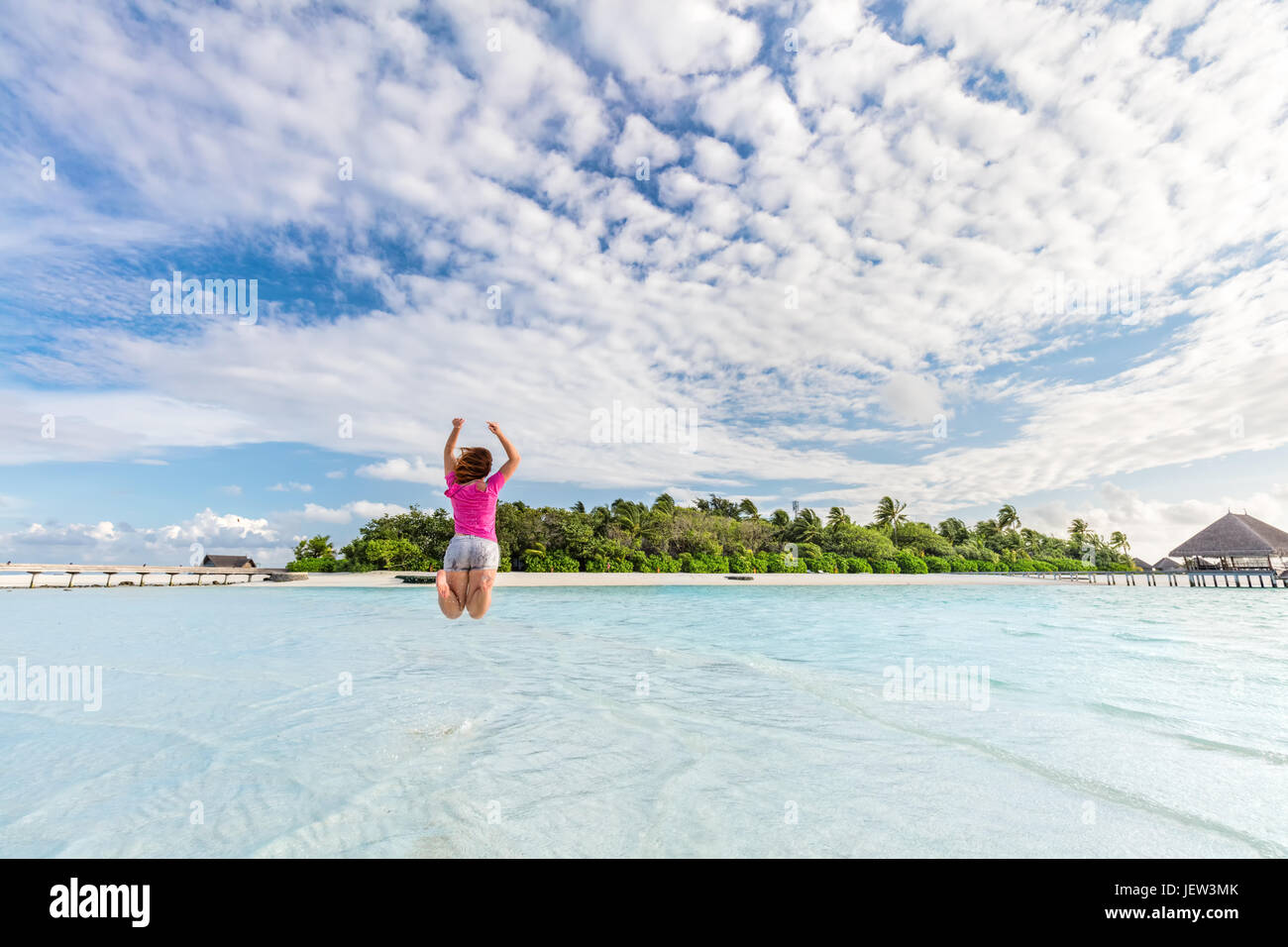 Woman jump beach energy hi-res stock photography and images - Alamy