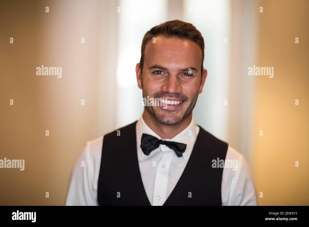 Waiter smiling at camera Stock Photo - Alamy
