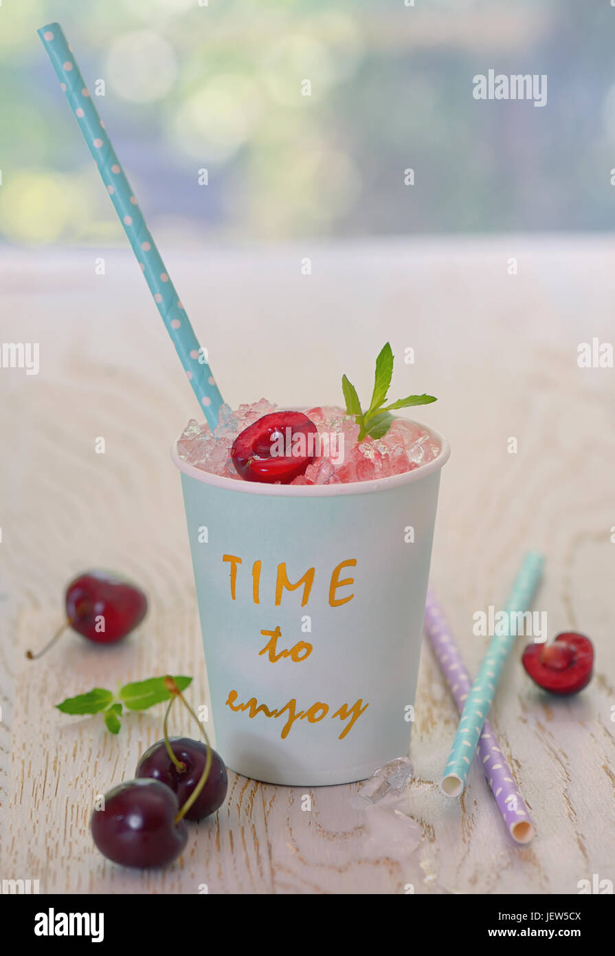 cherry syrup with ice in summer time Stock Photo - Alamy