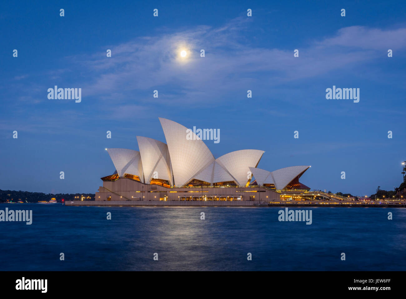 View on Sydney Opera house with moon at night, long exposure Stock ...