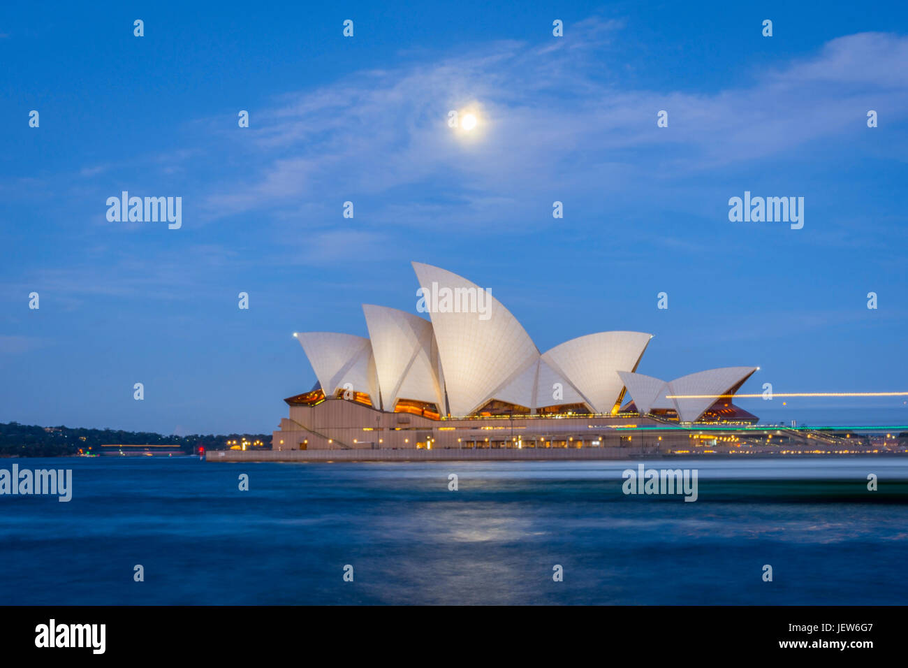 View on Sydney Opera house with moon at night, long exposure Stock ...