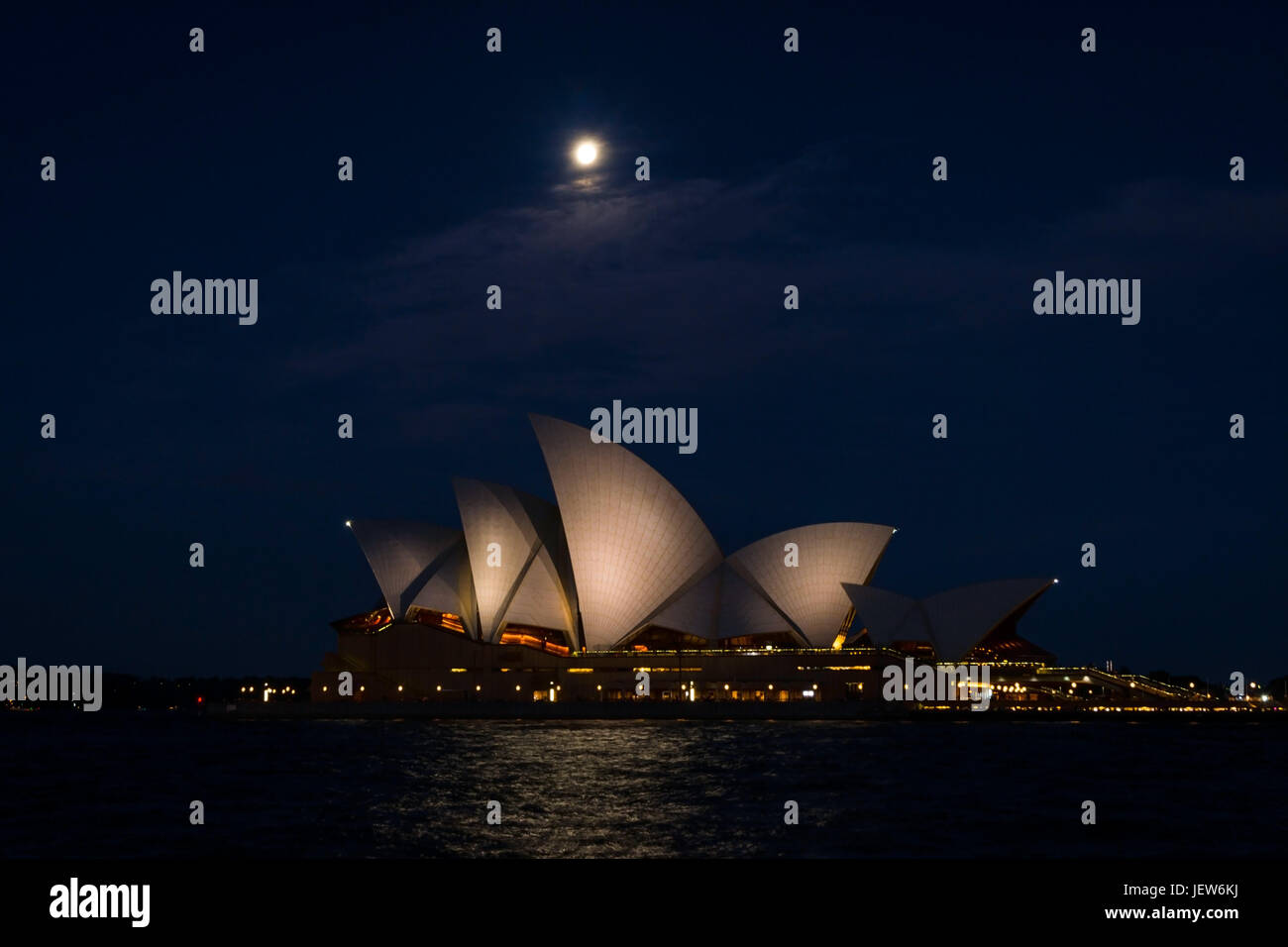 View on Sydney Opera house at night with moon Stock Photo - Alamy