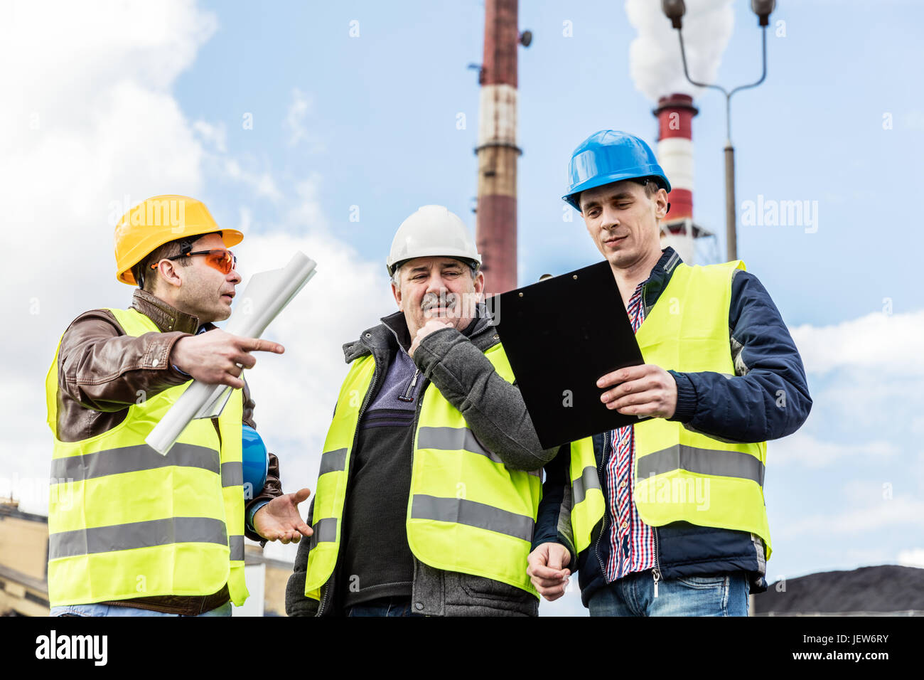 Construction engineers examining thermoelectric power station. Heat and ...