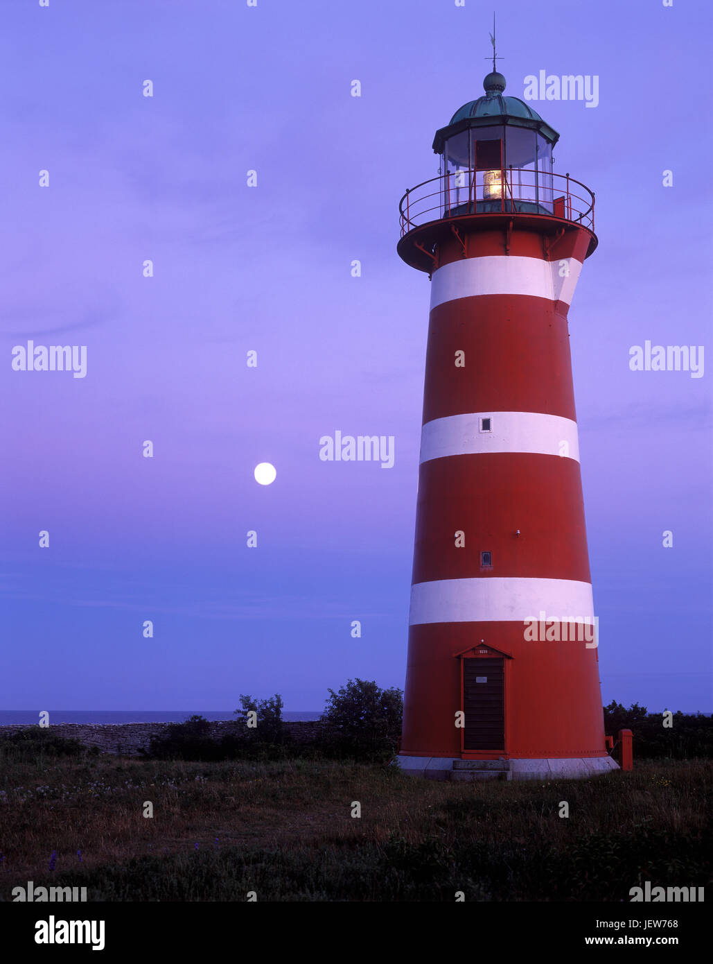 Lighthouse at dusk Stock Photo - Alamy