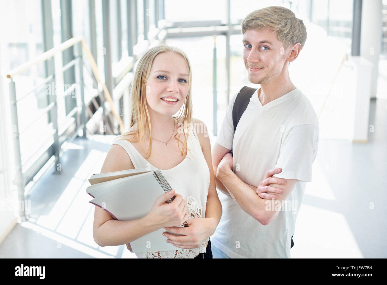 Friends together on corridor Stock Photo - Alamy
